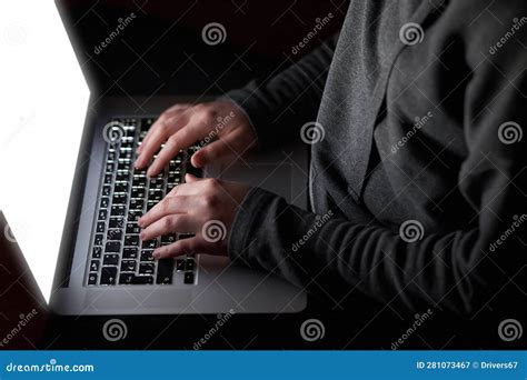 Overhead Hacker In The Hood Working With Laptop Typing Text In The Darkroom Stock Image Image