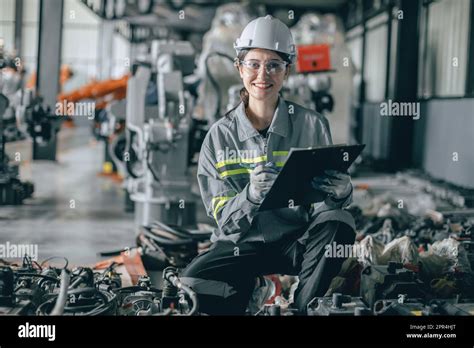 Engineer Woman Team Worker Work In Machine Robotic Modern Automation