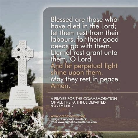 A Memorial With Flowers And A Cross In The Background That Says