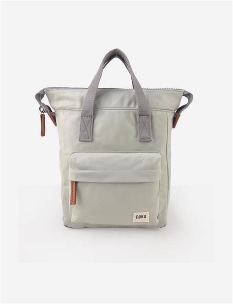 Roka תיק גב מרופד רוקה בצבע ערפל וכיס חיצוני מרובע החל מ 249 90