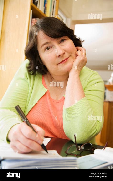 Woman Writing A Check Stock Photo Alamy