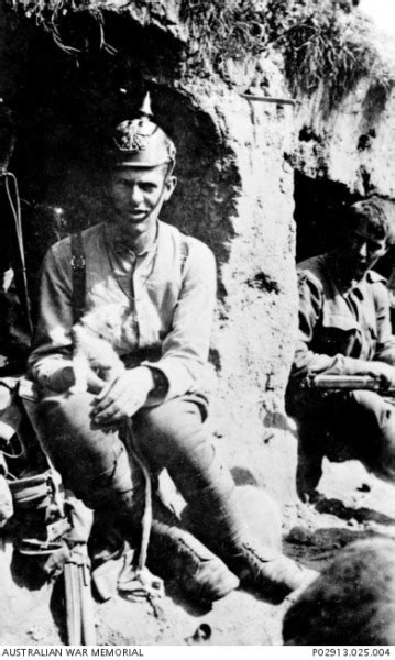 Two Australian Soldiers Sit In Dugouts In The Tren Tumbex