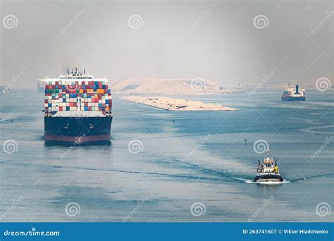 Huge Cargo Ships Navigate Through Suez Canal Shipping Canal In Egypt