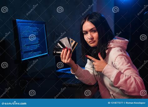 Teenager Hacker Girl In Hood Using Mobile Phone In Internet Cyber Crime Expert Or Cybercrime