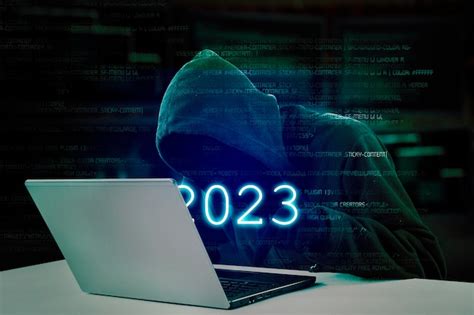 Premium Photo Hacker Using A Laptop With 2023 Number