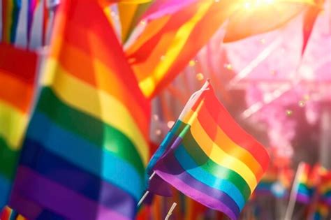 Ai는 게이 퍼레이드 거리에서 바람에 날리는 Lgbt 커뮤니티의 근접 촬영 무지개 깃발을 생성했습니다 프리미엄 사진