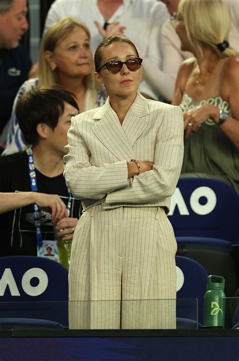 Jelena Djokovic Dons Striped Sandro Power Suit At Australian Open 2025