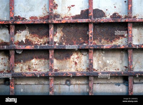 Abstract Vintage Iron Door With Rusty Corrosion Marks Eroded Holes And