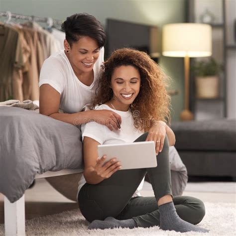You Cant Control Who You Fall In Love With A Young Lesbian Couple Using A Tablet While Relaxing