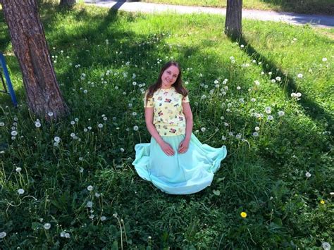 Premium Photo Woman Sitting On Grass In Field