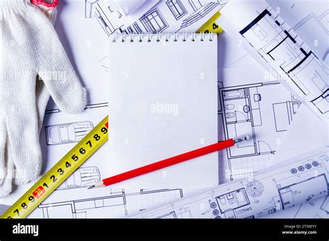 The Builder Records The Construction Costs Construction Plan Approval Notepad In The Hands Of