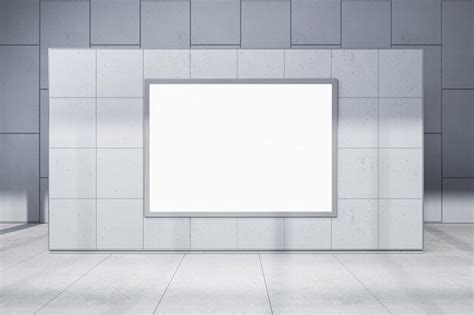 햇볕이 잘 드는 콘크리트 벽 파티션 야외 광고 개념 3d 렌더링에 로고 또는 텍스트를 위한 공간이 있는 빈 흰색 포스터의 전면 보기 프리미엄 사진