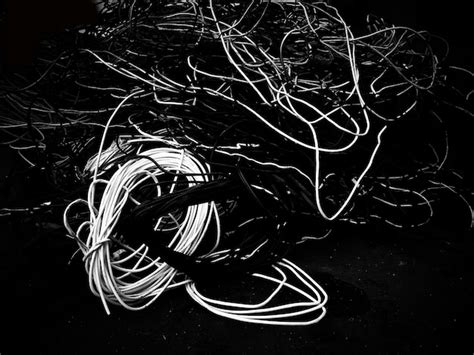 Premium Photo High Angle View Of Tangled Cables On Field