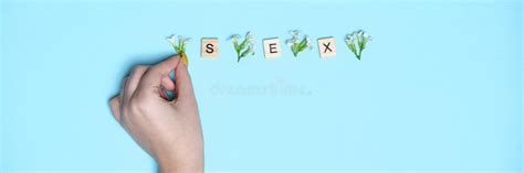 Woman Hand Pointing On Three Wooden Blocks Letters Sex On Them