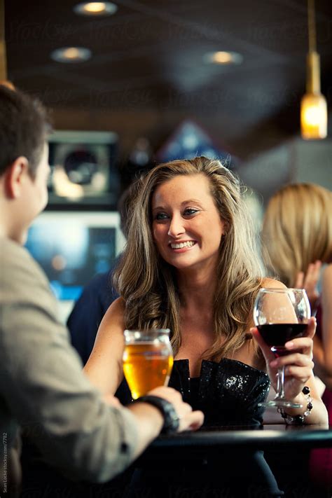 Bar Girl Talks With Babefriend At Bar By Stocksy Contributor Sean Locke Stocksy