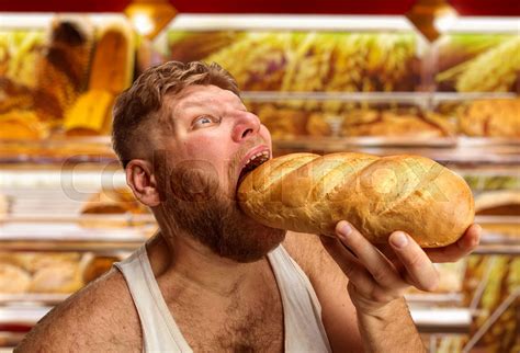 Man Eating Bread In The Shop Stock Image Colourbox