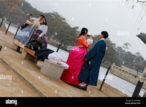 A Group Of People Taking Selfies In Korean Traditional Clothes Seoul