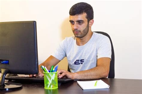 Premium Photo Programmer At The Work Programmer In The Office