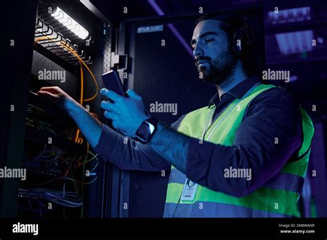 Close Up Of Black Man As Network Technician Using Control Panel While