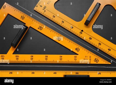 Triangle Protractor Ruler And Drawn Acute Angle On Black Table Flat