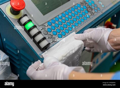 A Female Employee Performs Visual Quality Control Of Hosiery Even High Precision Manufacturing