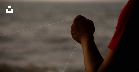 A Person Holding A String Photo Free Human Image On Unsplash