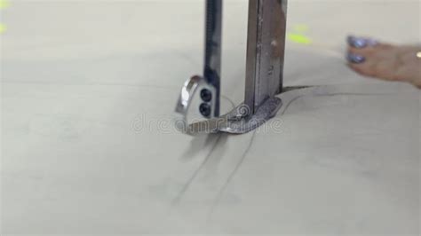 Female Worker On A Sewing Manufacture Uses Electric Cutting Fabric Machine Media Sewing