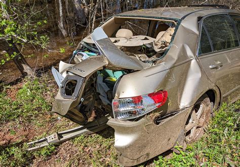 Car Crashes Backwards Into Tree Driver Is Ejected Into Beaver Pond