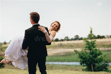 Newly Married Couple Having Fun In A Park Stock Image Image Of Husband Lifting 113554939