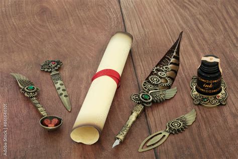 Parchment Faded Paper Scroll With Feather Quill Nib Pen And Old Brass Writing Equipment For