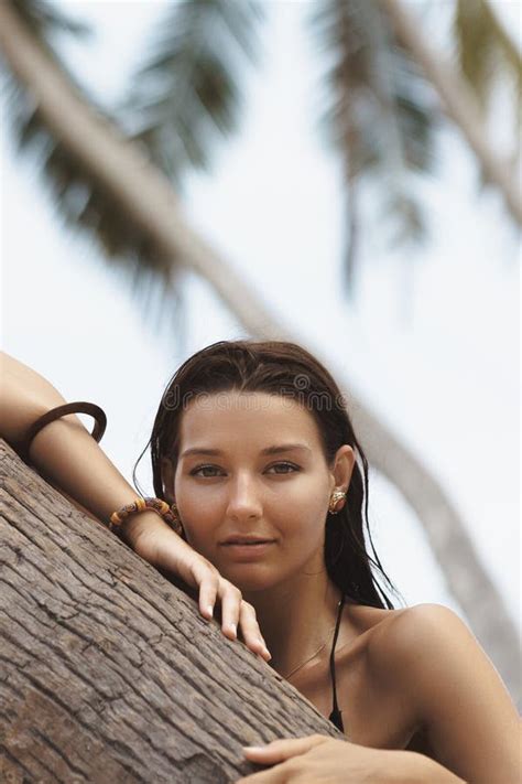 Tanned Woman In Black Bikini On The Summer Beach Near Palm Tree Stock
