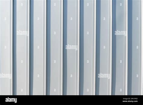 The Texture Of The Cladding Of The Building From Metal Aluminum Panels Abstract Background For