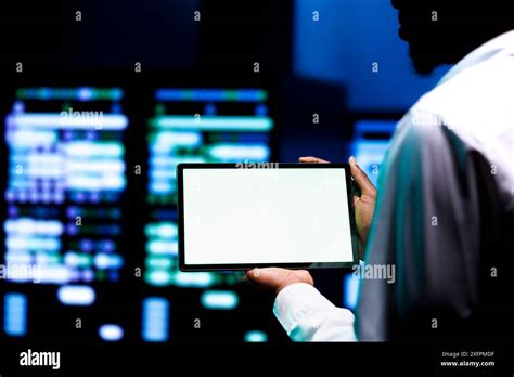 Expert Using Mock Up Tablet To Examine Data Center Hardware Configuration Settings Serviceman Expert Using Mock Up Tablet To Examine Data Center Hardware Configuration Settings Serviceman