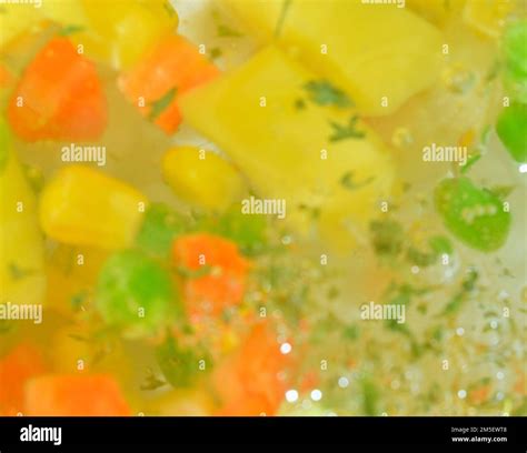 Boiling Water With Fresh Vegetables Close Up Close Up View Of The Soup Vegetables With Carrots