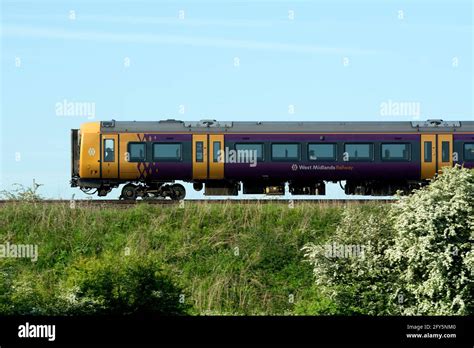 West Midlands Railway Class 172 Diesel Train Side View In Spring
