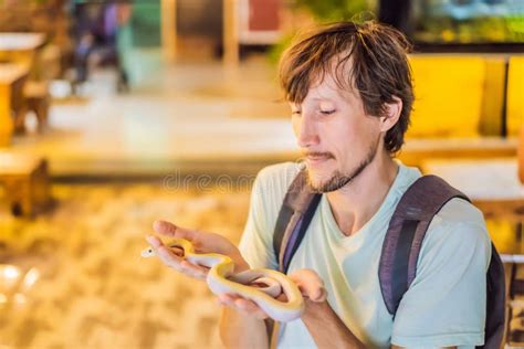A Man Holding A Small Python In His Hands Stock Image Image Of Model People 198294409