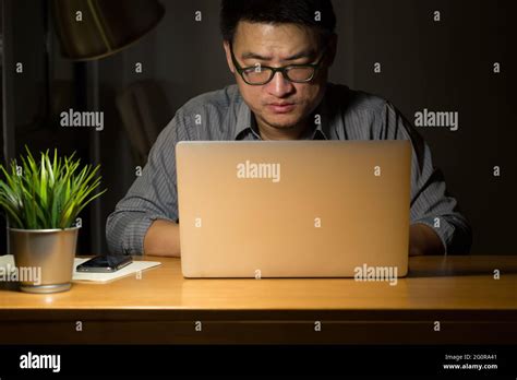Asian Business Man Working At Night Freelance Programmer Or Developer Working At Home And