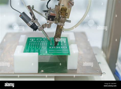 automated printed circuit board pcb assembly machine in action demonstrating its precision