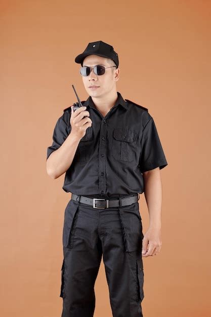 Premium Photo Portrait Of Male Security Guard In Sunglasses Talking