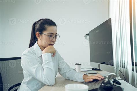 Asian Female Software Developer Is Worried About Analyzing Code Based Systems At His Office