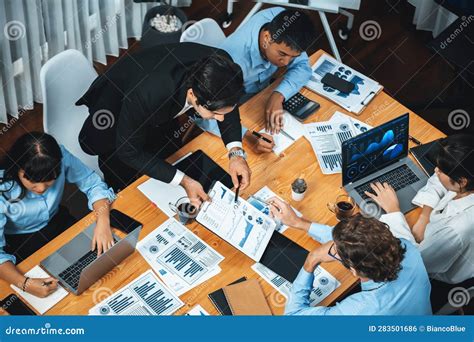 Wide Top View Diverse Analyst Team Analyzing Financial Data Meticulous