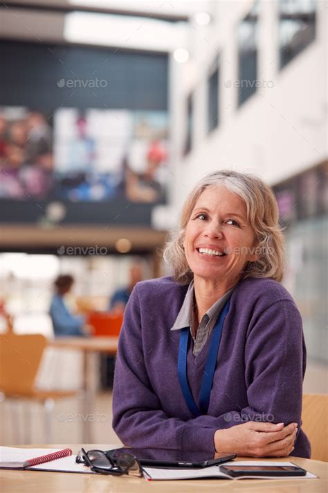 Portrait Of Mature Female Teacher Or Student With Digital Tablet