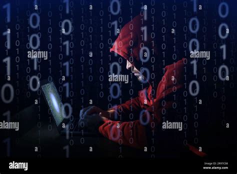 cyber attack anonymous hacker working with laptop on dark blue