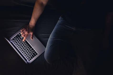 Free Photo Busy Man Networking On Laptop Late At Night Typing Text