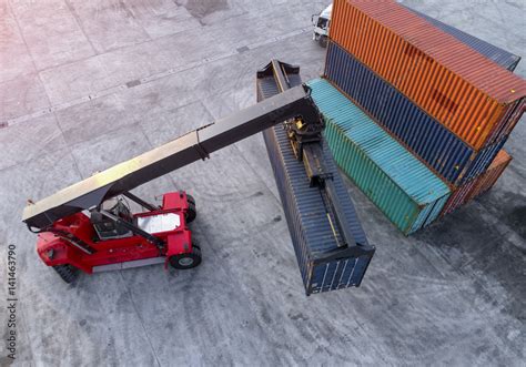 Stacker Forklift Working On Lifting Containers In Yard In Aerial View Stock Photo Adobe Stock