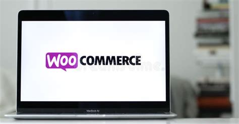 Logo Design Of Woocommerce On A Laptop Screen In Blurred Background