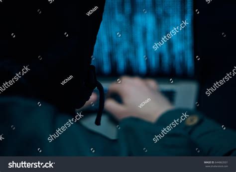 Male Hacker Working Behind Laptop Hacker Stock Photo
