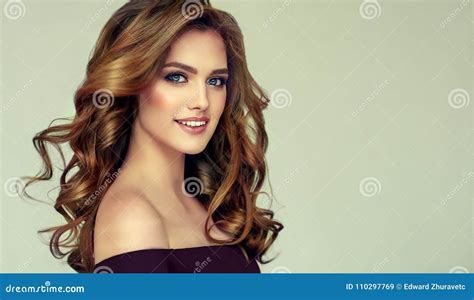 Brown Haired Woman With Voluminous Shiny And Curly Hairstyle Frizzy