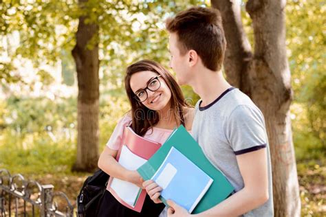 Female Babe In Love Looking At A Handsome Classmate Stock Image