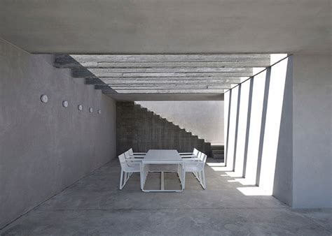 Concrete Home By Osm Is Sunken Into A Hill By An Italian Lake